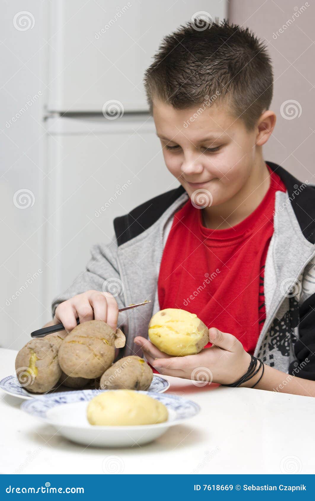 Boy peeling potatoes stock image. Image of helps, peel - 7618669