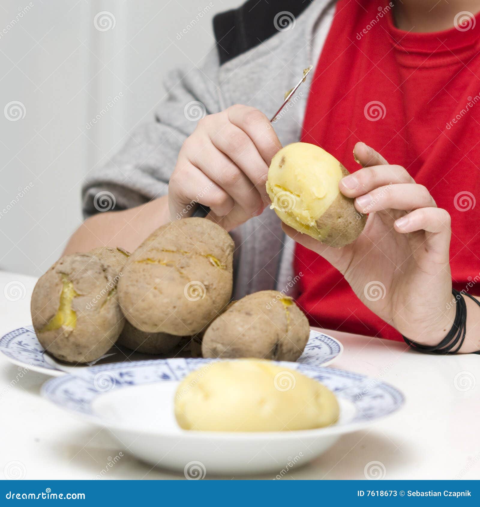 Boy peeling potatoes stock image. Image of help, potato - 7618673