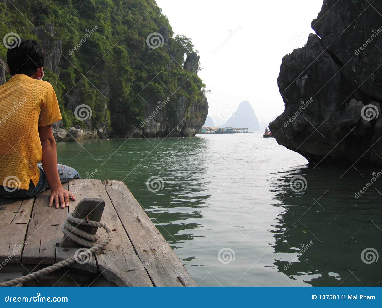 Boy peering out to sea stock image. Image of sailboats - 107501