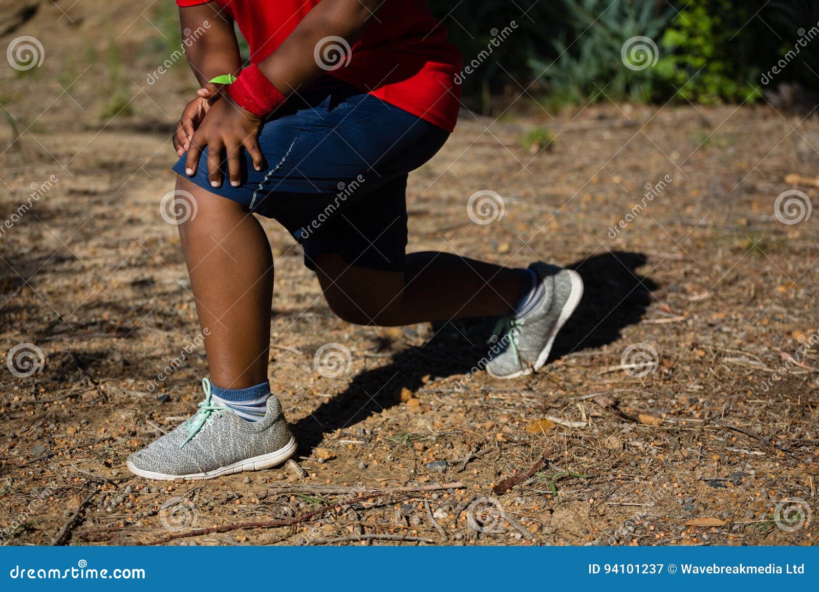 Boy Performing Stretching Exercise during Obstacle Course Training ...