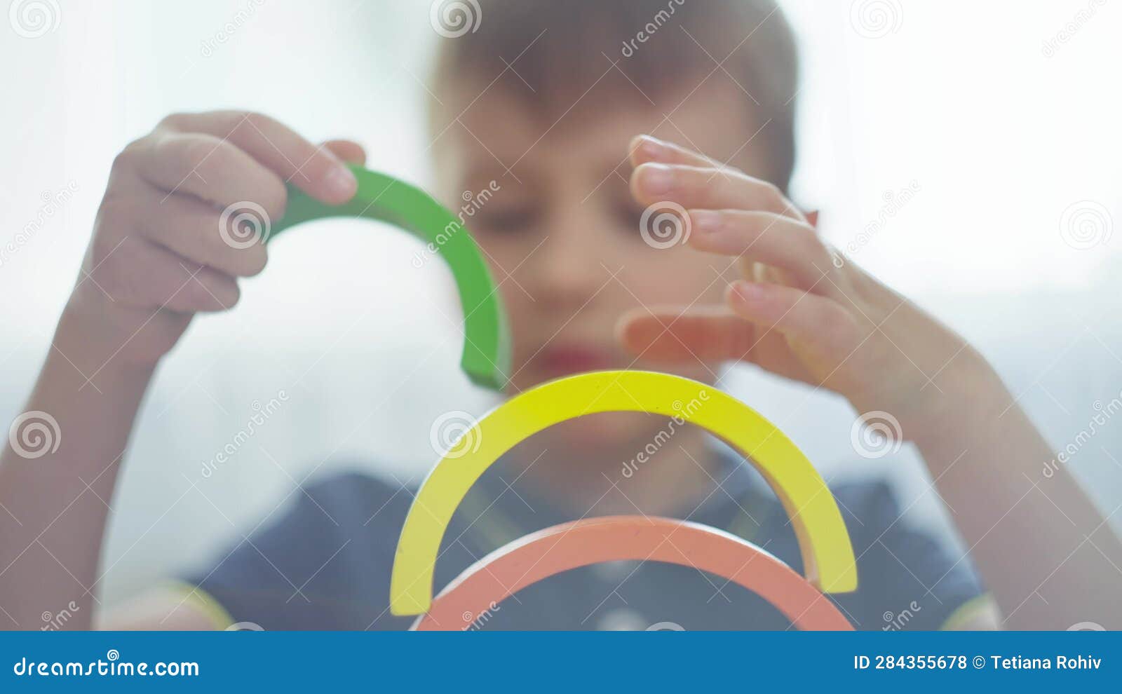 The Boy Performs a Developmental Task on Hand Motor Skills. Stock ...