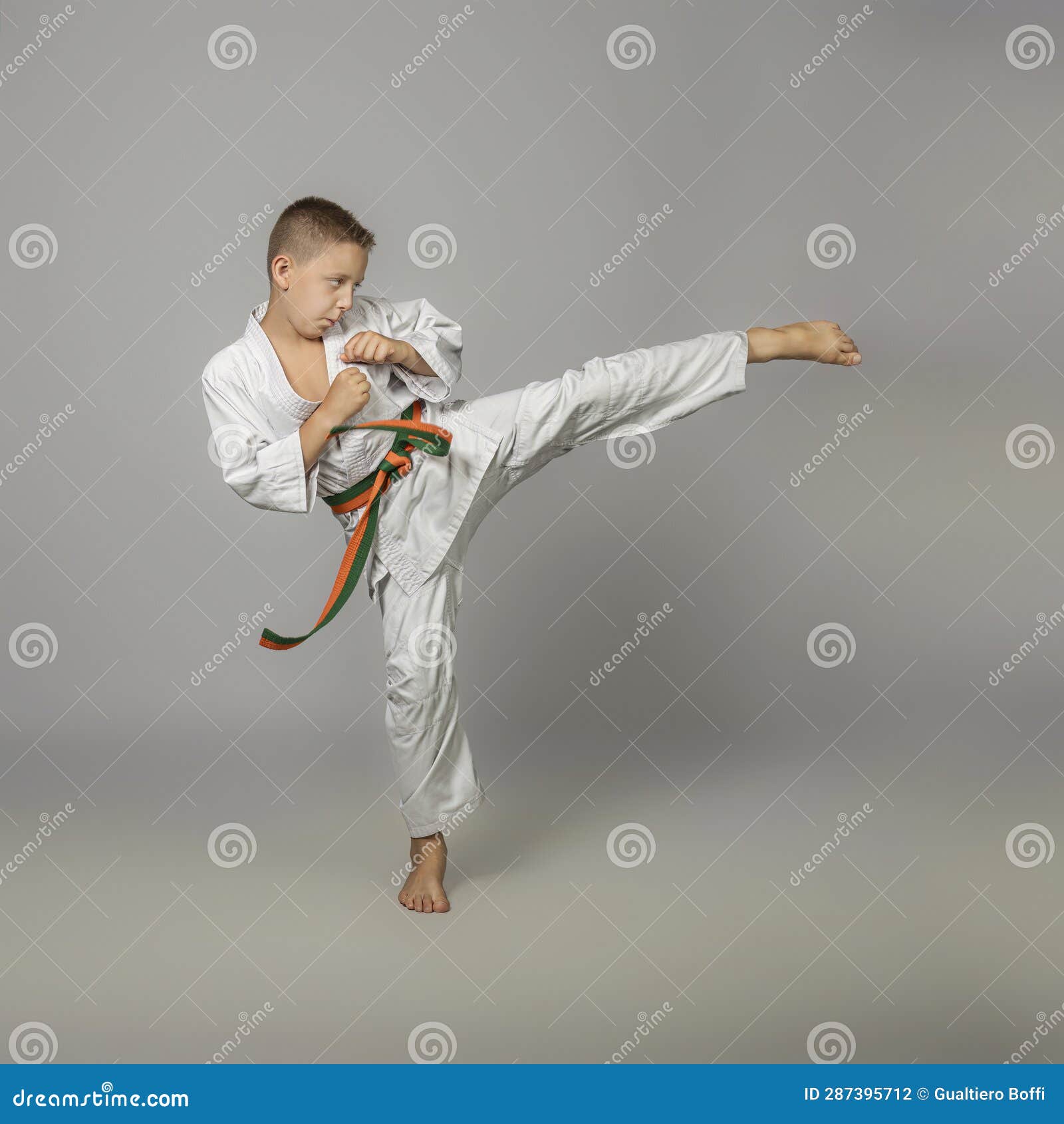 Boy performs a side kick stock photo. Image of jujitsu - 287395712