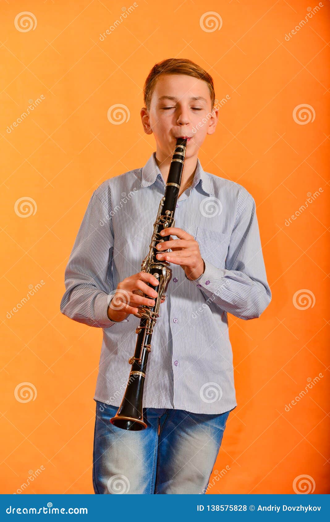 The Boy Performs Solo at a Concert, Plays the Clarinet on an Orange ...
