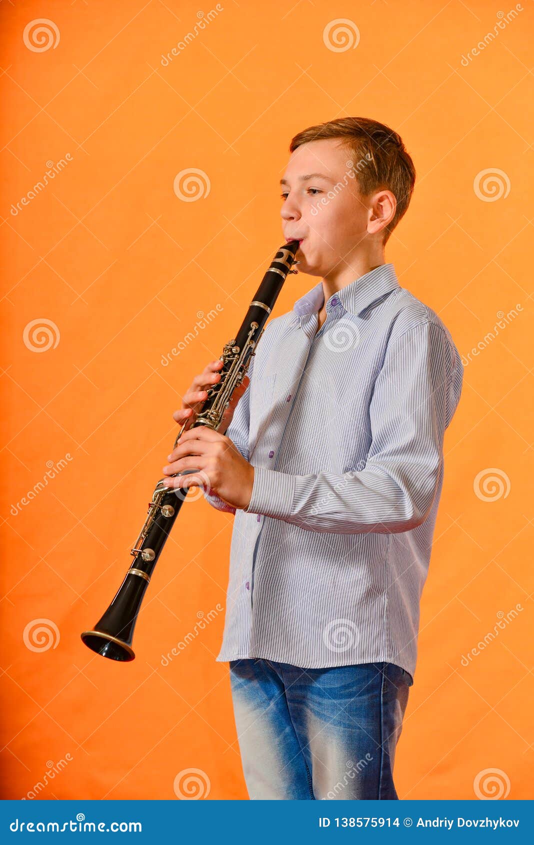 The Boy Performs Solo at a Concert, Plays the Clarinet on an Orange ...