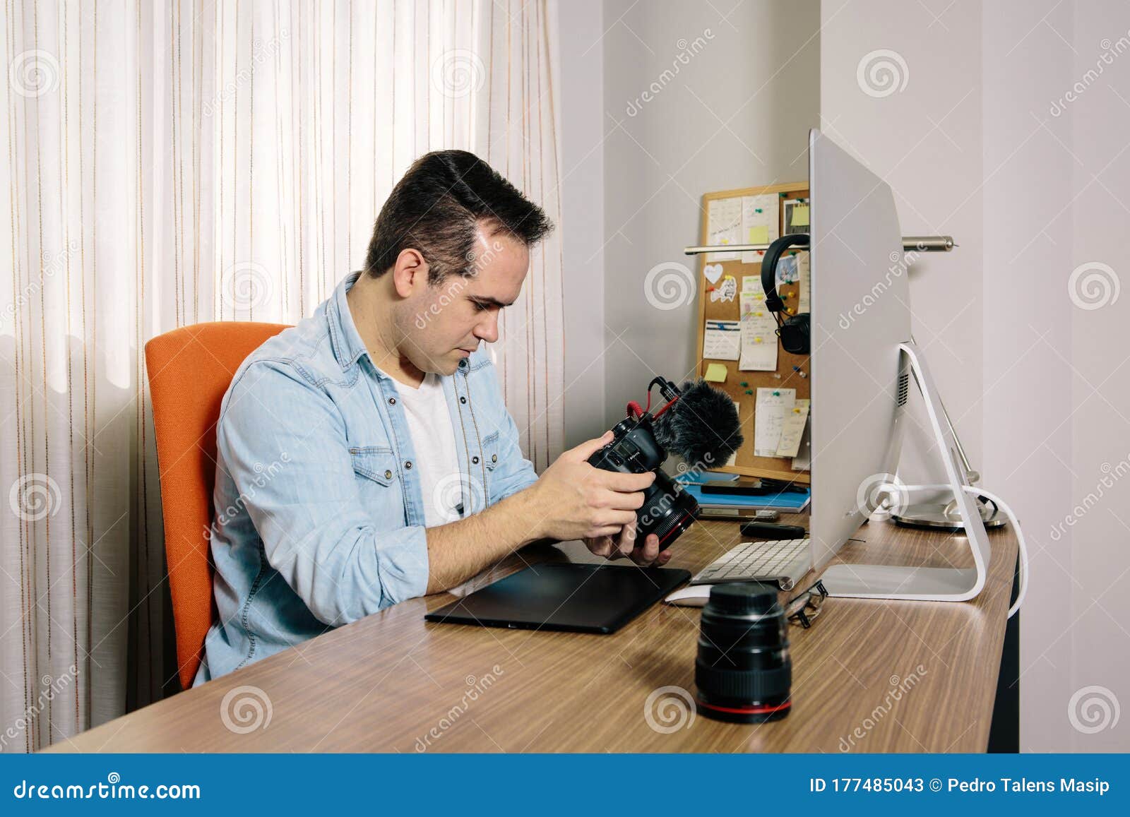 Boy Photographer Preparing His Camera while Working from Home on His ...