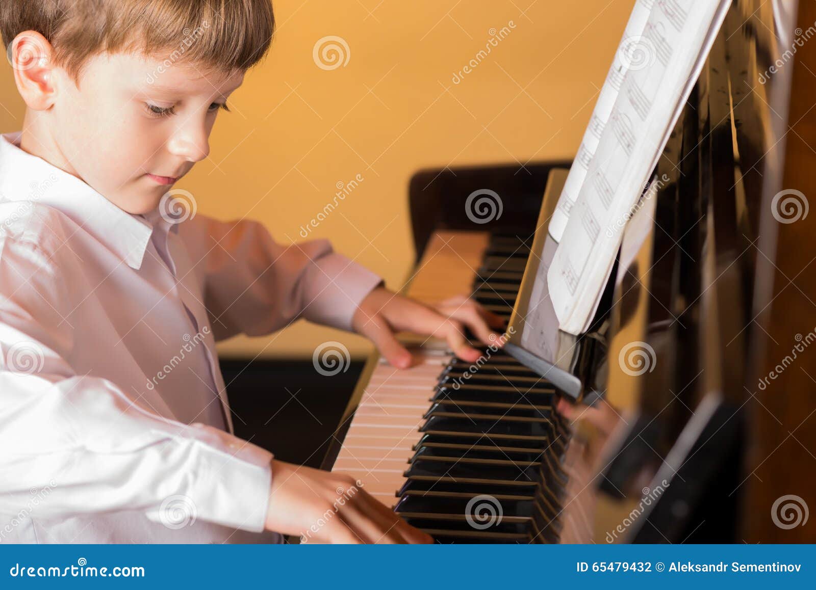 Boy piano. Piano player. stock photo. Image of performing - 65479432