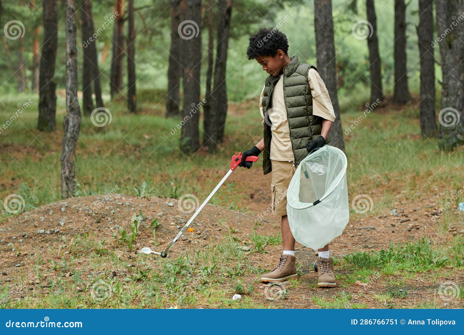 Boy Picking Up Garbage in the Forest Stock Image - Image of planet ...