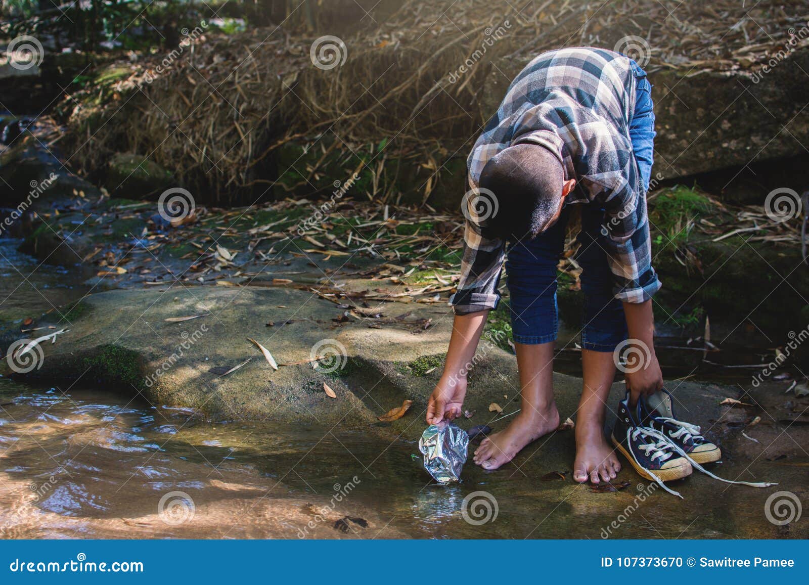 Boy Picking Up Plastic Garbage in Forest Stock Photo - Image of outdoor ...