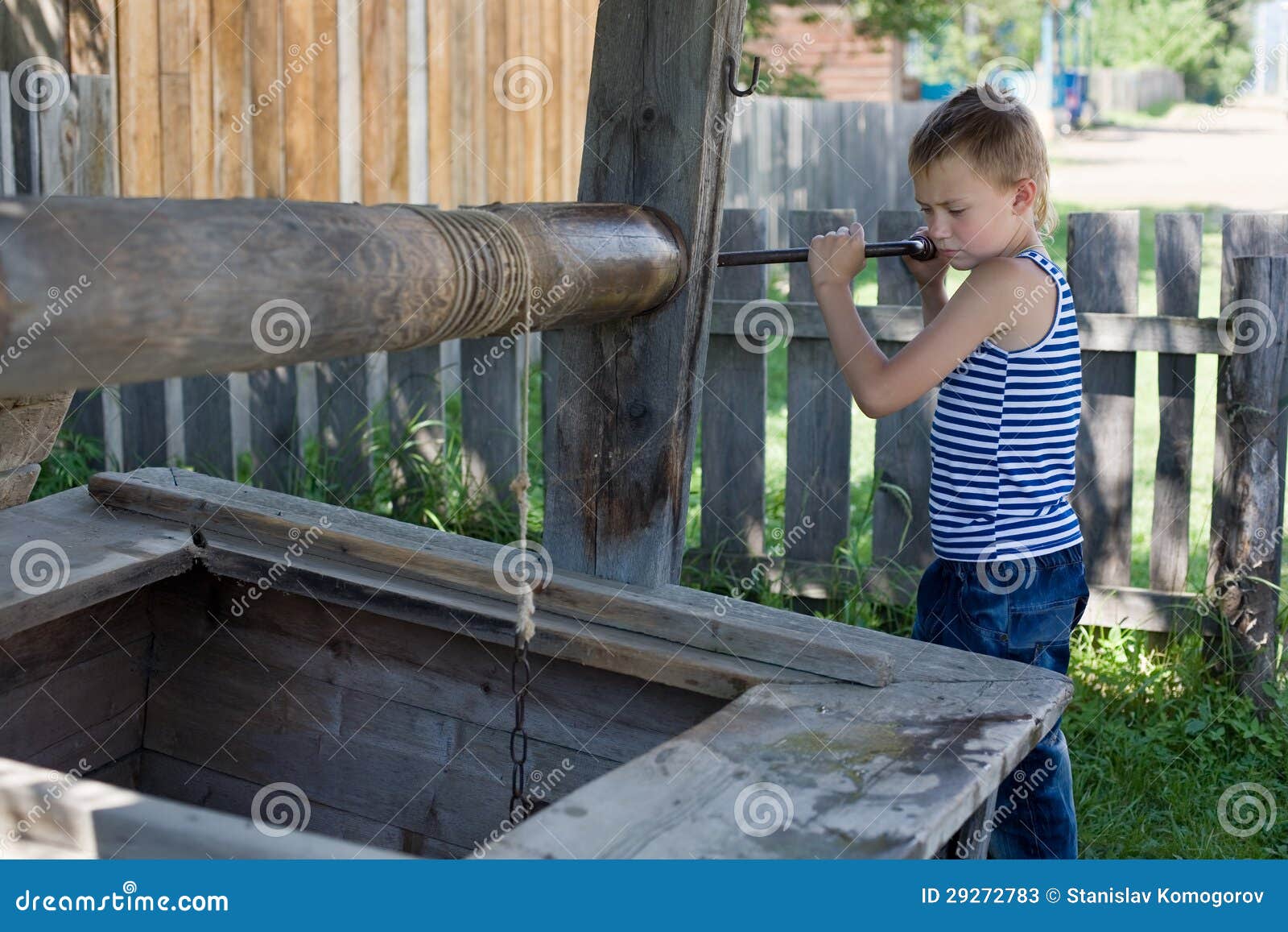Boy Picks Up a Bucket with Water Stock Image - Image of thirsty ...