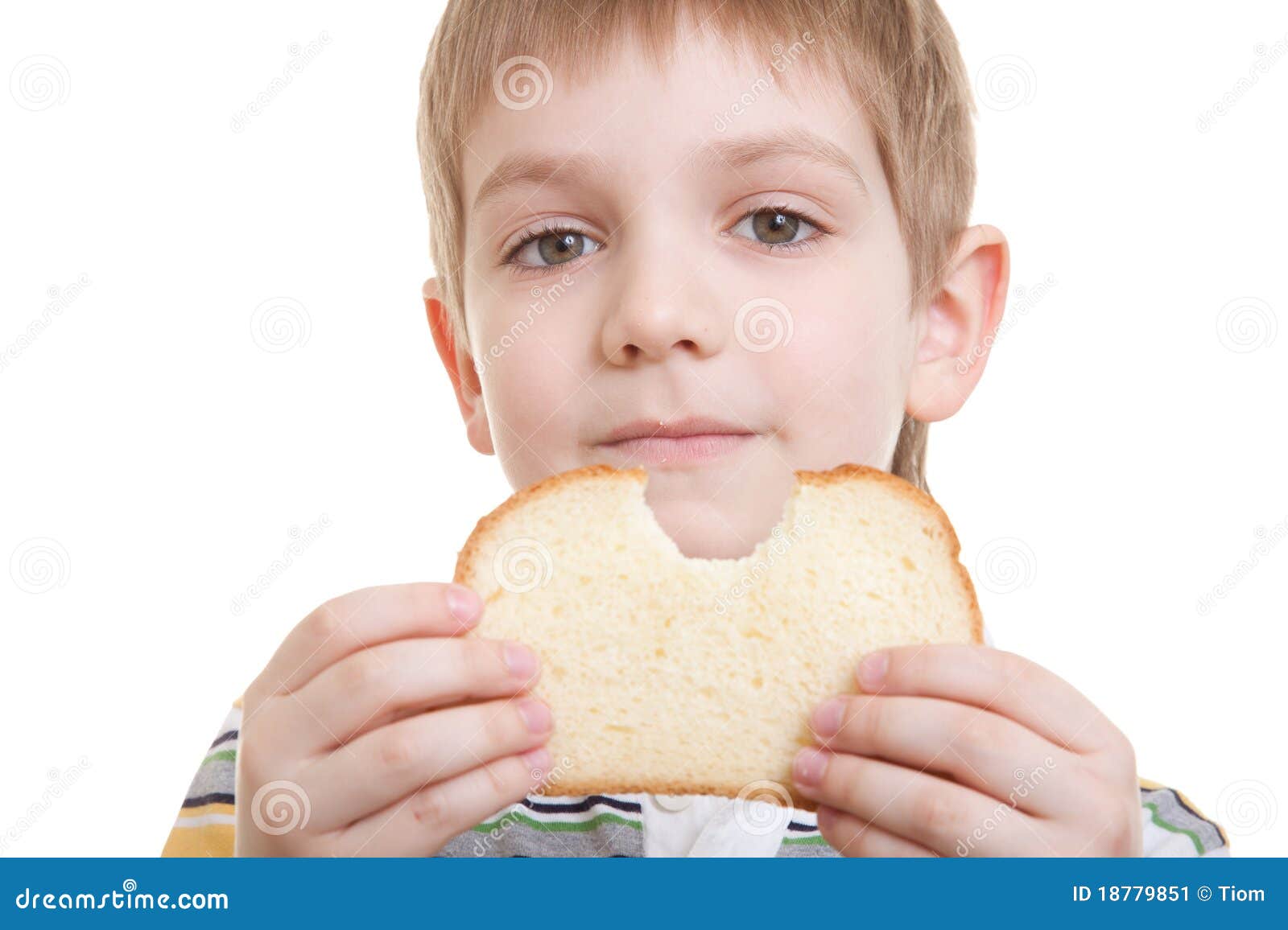 Boy with piece of bread stock image. Image of bite, eating - 18779851