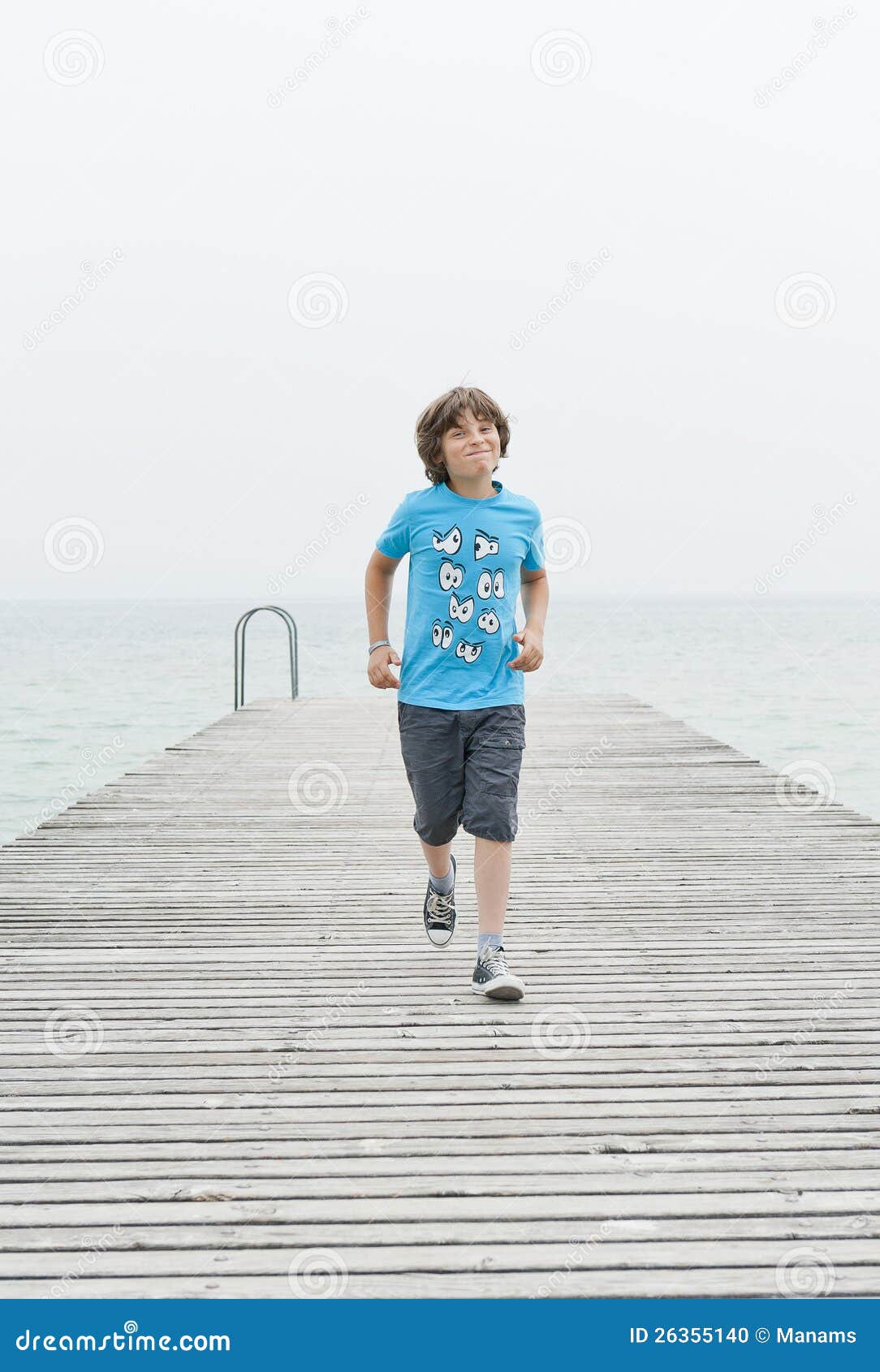 Boy on the pier stock photo. Image of nature, young, teen - 26355140