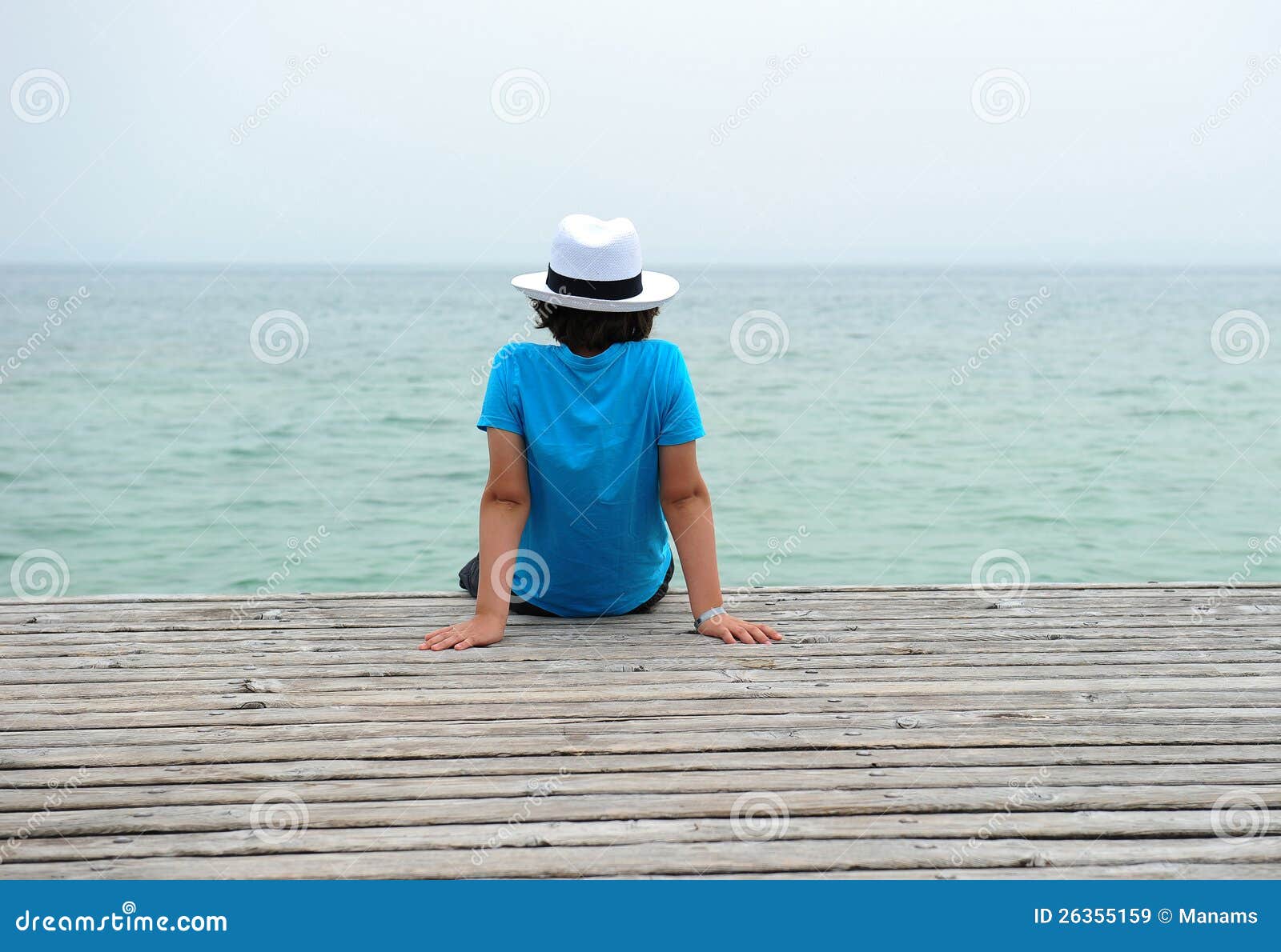 Boy on the pier stock image. Image of lifestyle, blue - 26355159