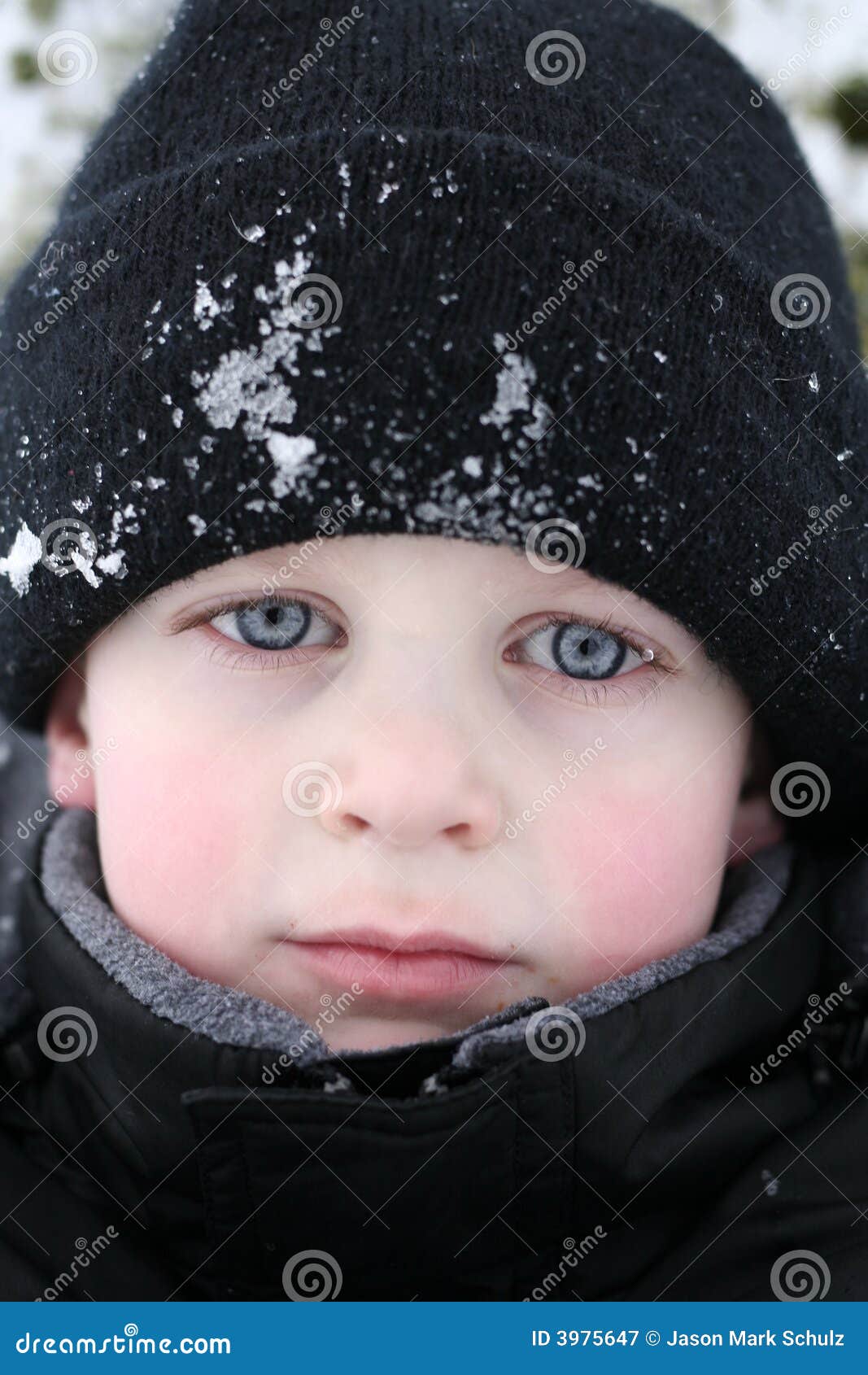 Boy piercing look in snow stock image. Image of snow, direct - 3975647