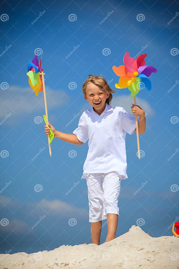 Boy with pinwheels stock photo. Image of smiles, little - 11448664