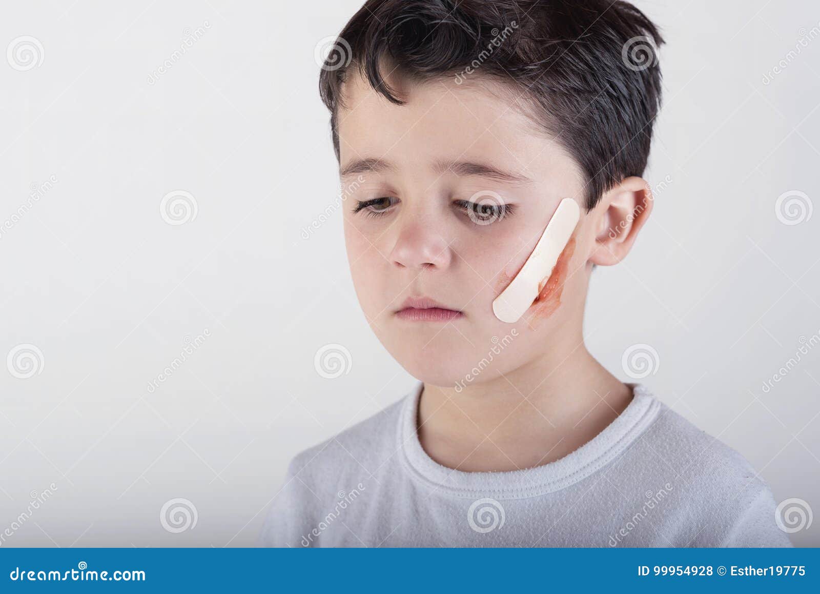 Boy with a Plaster on His Face Stock Photo - Image of background ...