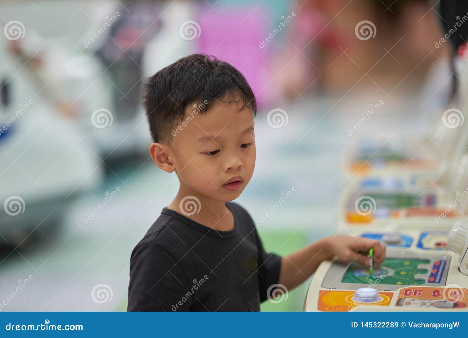 Boy Play Game in Arcade Alone Stock Image - Image of little, button ...