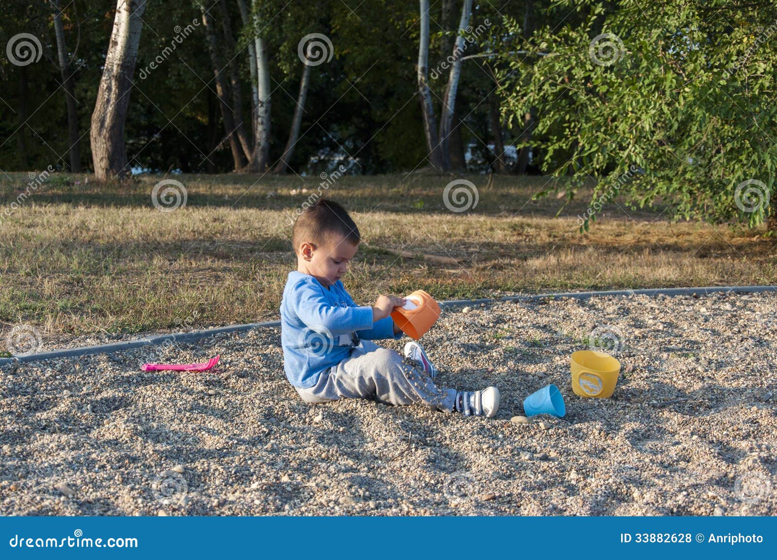 Boy play in the sand stock photo. Image of ground, childhood - 33882628