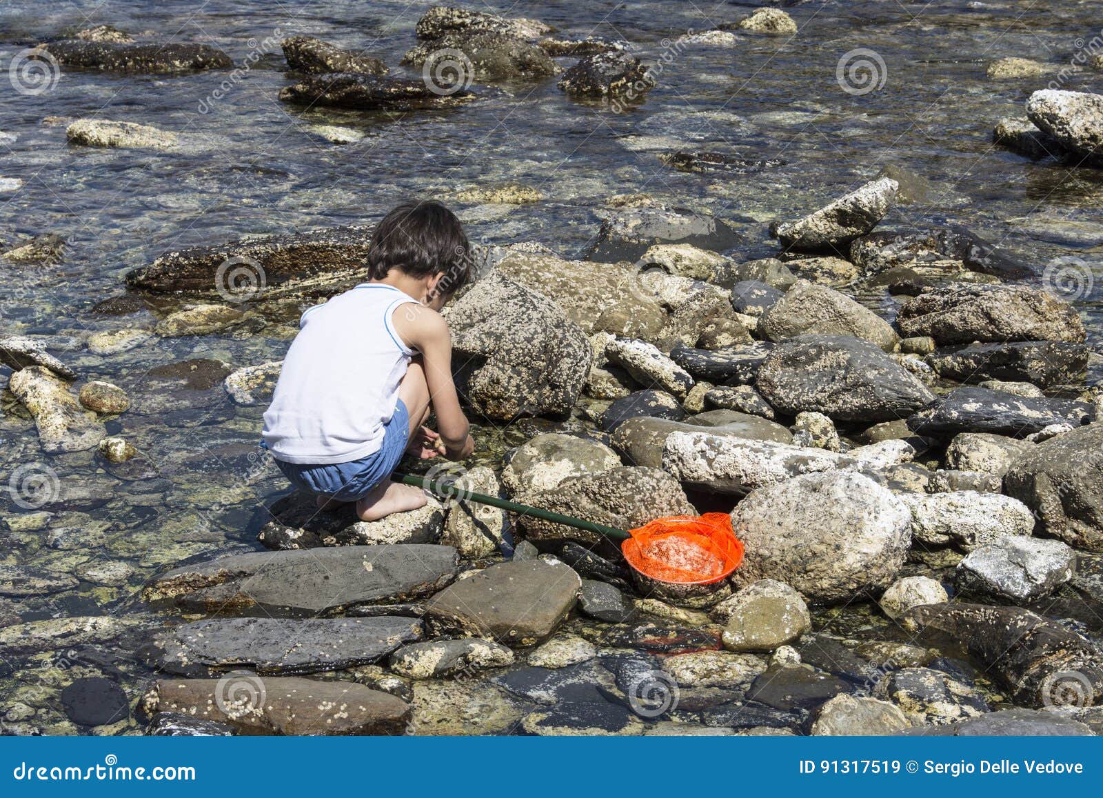 A boy play on the sea editorial stock image. Image of leisure - 91317519