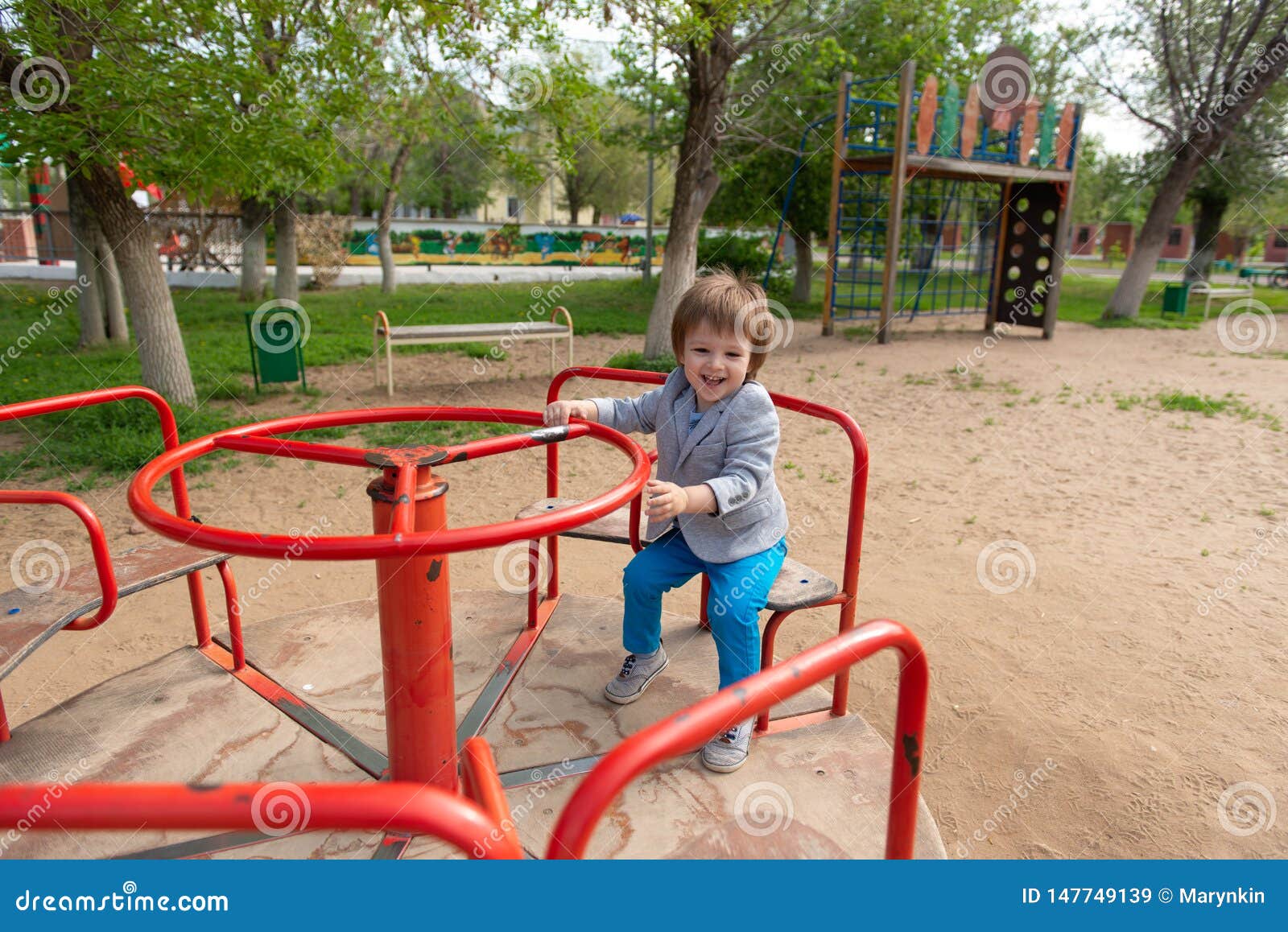 Boy on the Playground Rides on a Swing Stock Image - Image of kids ...