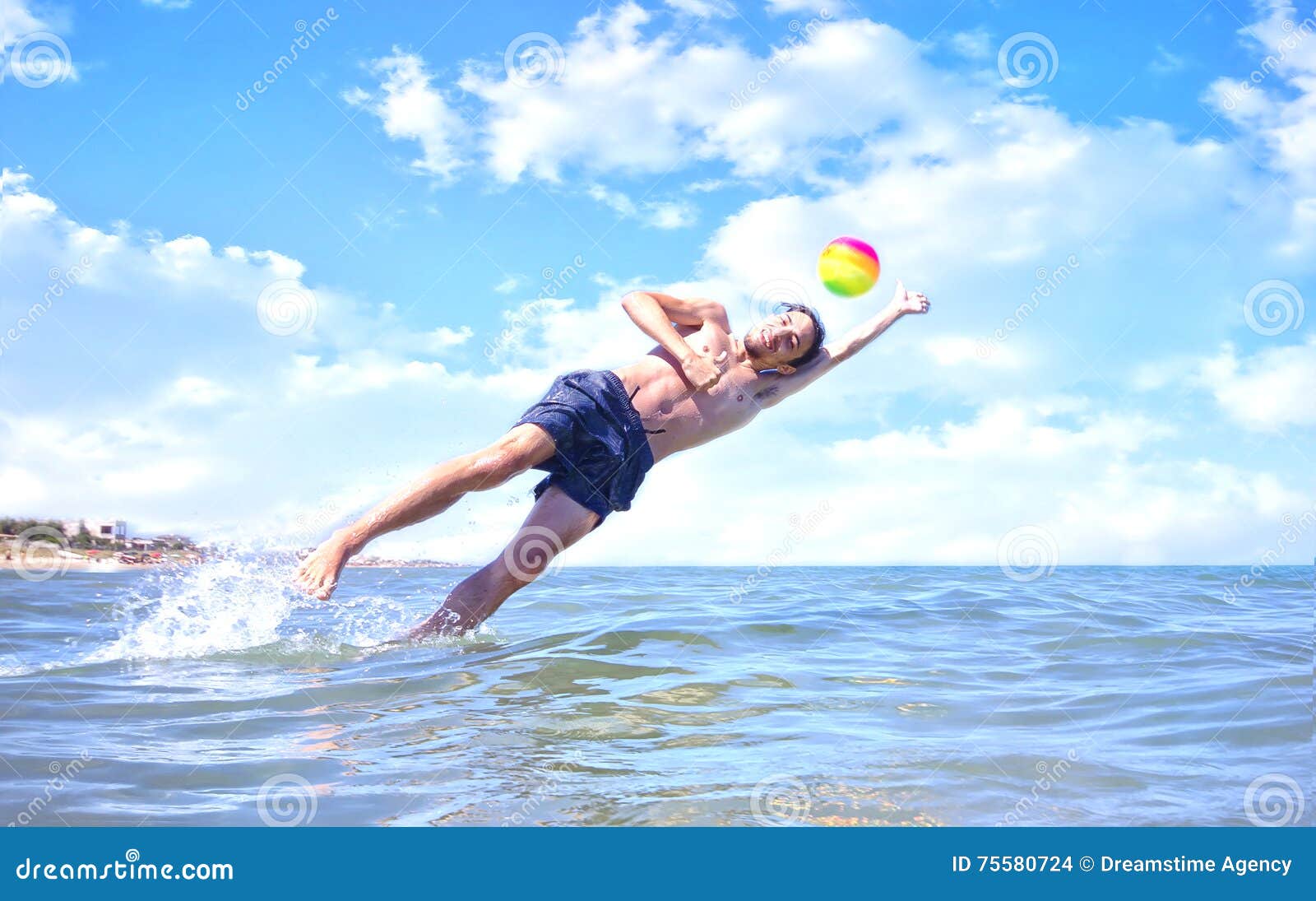 Boy Playing Ball in the Sea Stock Photo - Image of outdoors, action ...