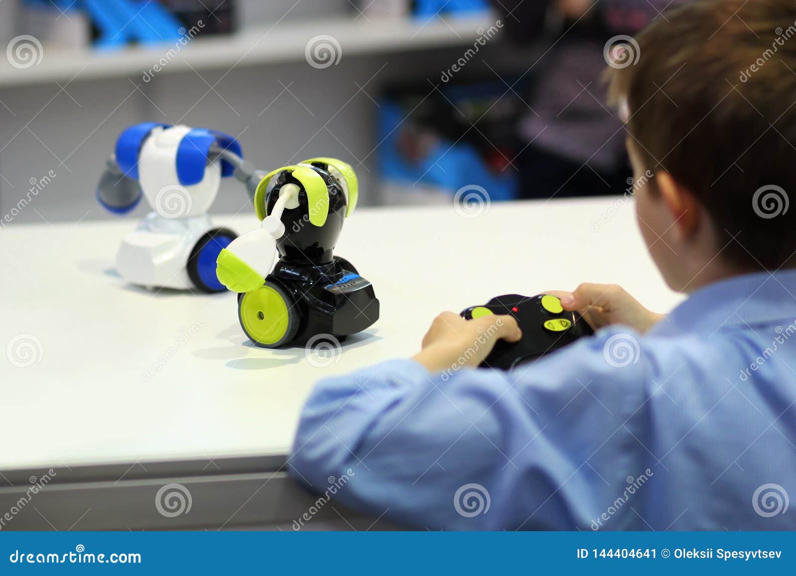 Boy Playing Battle Fighting Robots with Remote Control. Robotics Stock ...