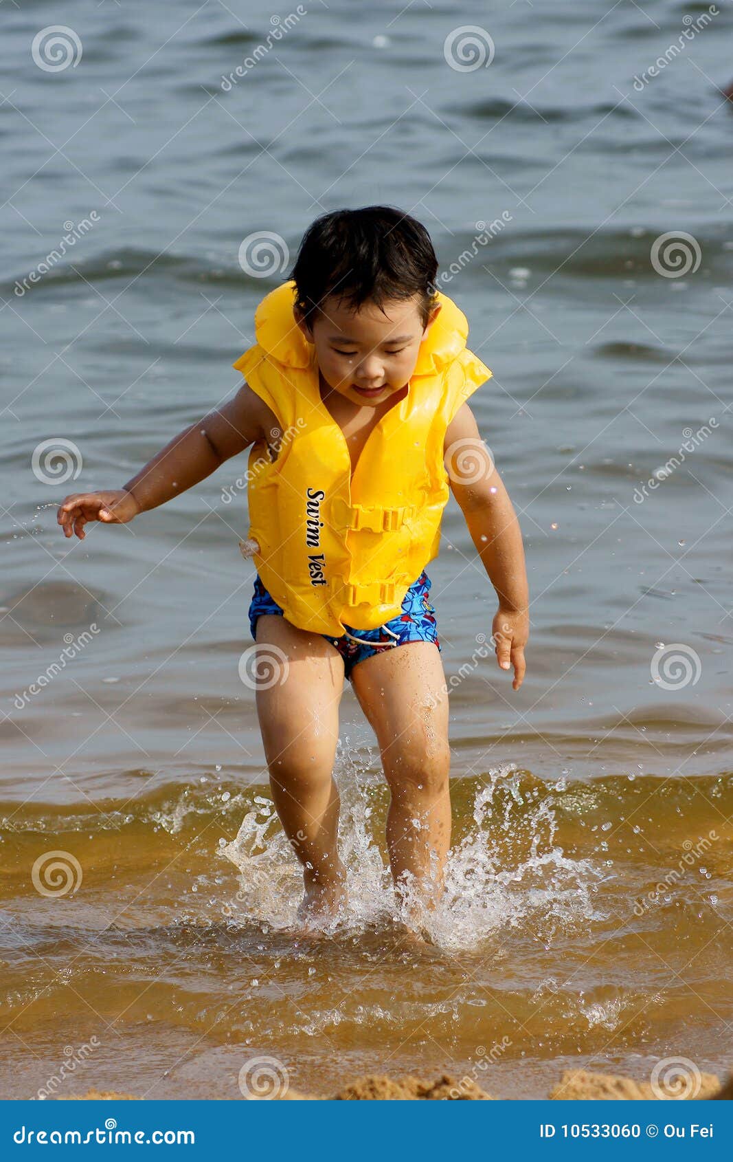 Boy playing on beach stock photo. Image of summer, splashing - 10533060