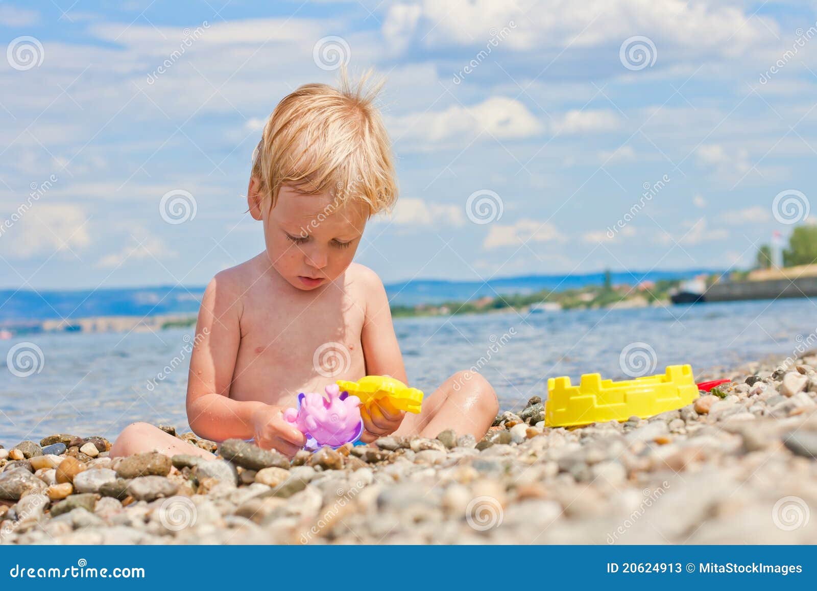 Boy playing on the beach stock image. Image of caucasian - 20624913