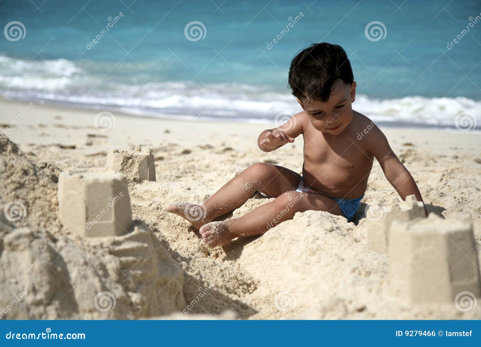 A boy playing on the beach stock photo. Image of happy - 9279466