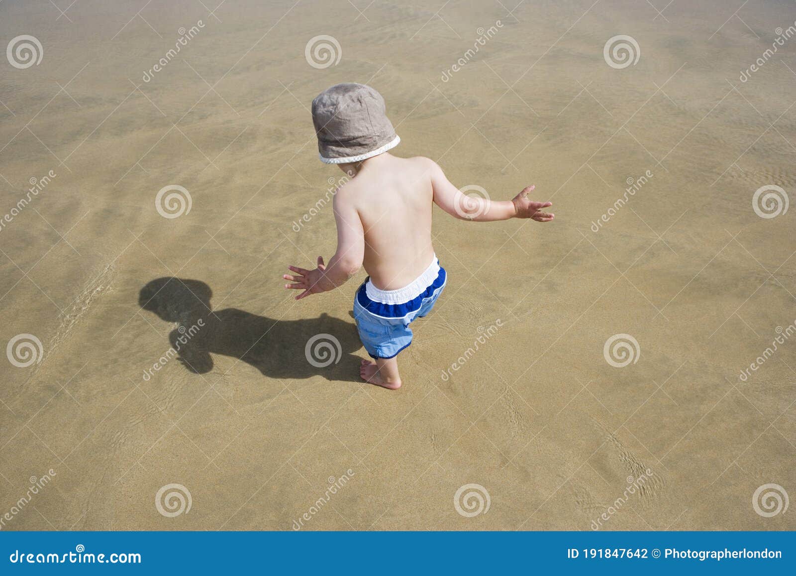 Boy (3-4) Playing on Beach Back View Stock Photo - Image of activity ...