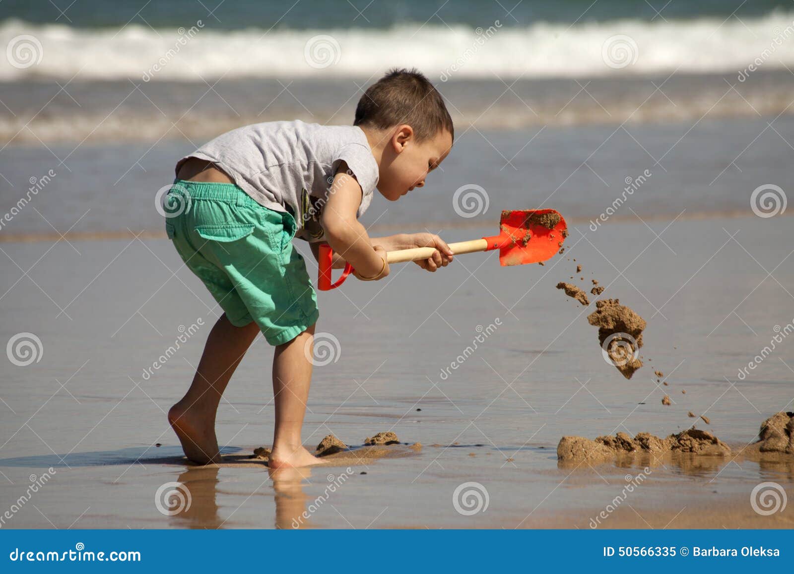 Boy playing on the beach stock image. Image of ocean - 50566335