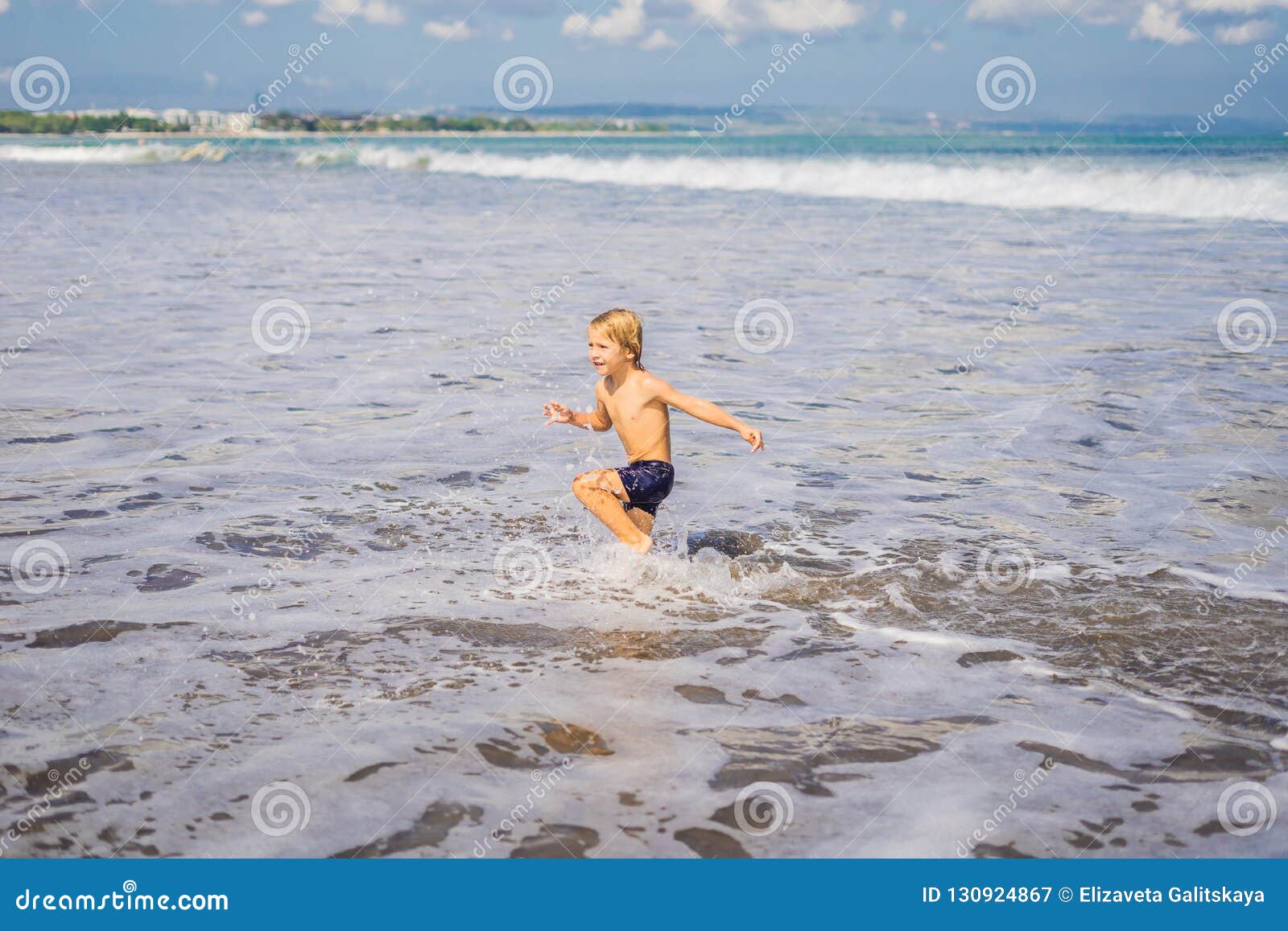 Boy Playing on the Beach in the Water Stock Image - Image of caucasian ...