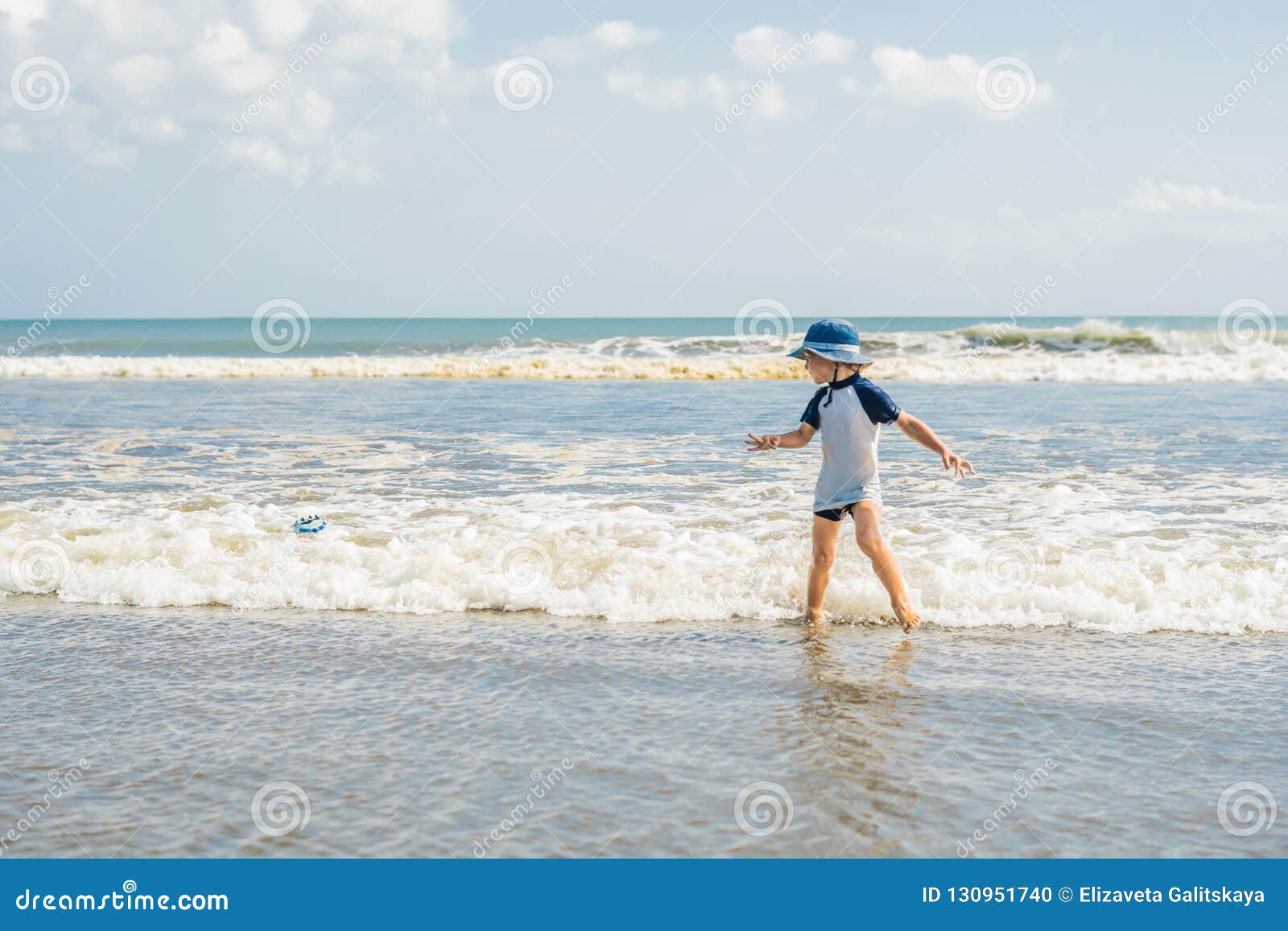 Boy Playing on the Beach in the Water Stock Photo - Image of playing ...