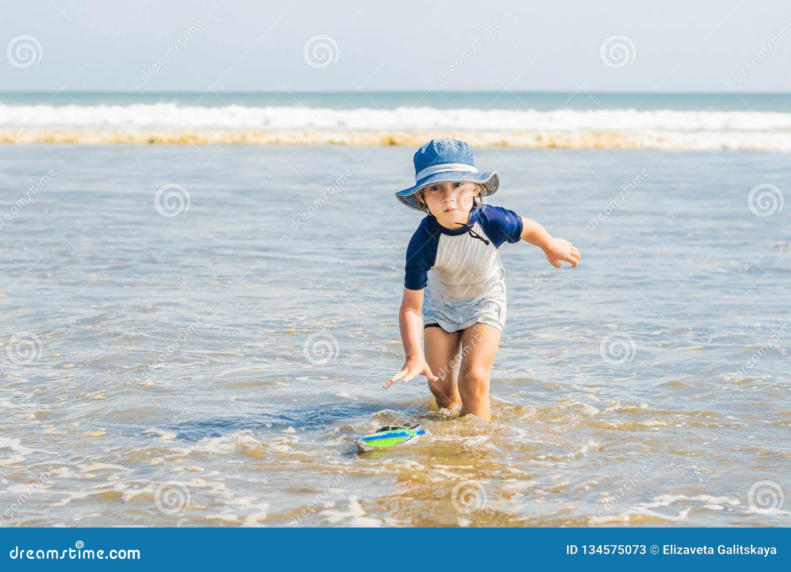 Boy Playing on the Beach in the Water Stock Image - Image of playing ...