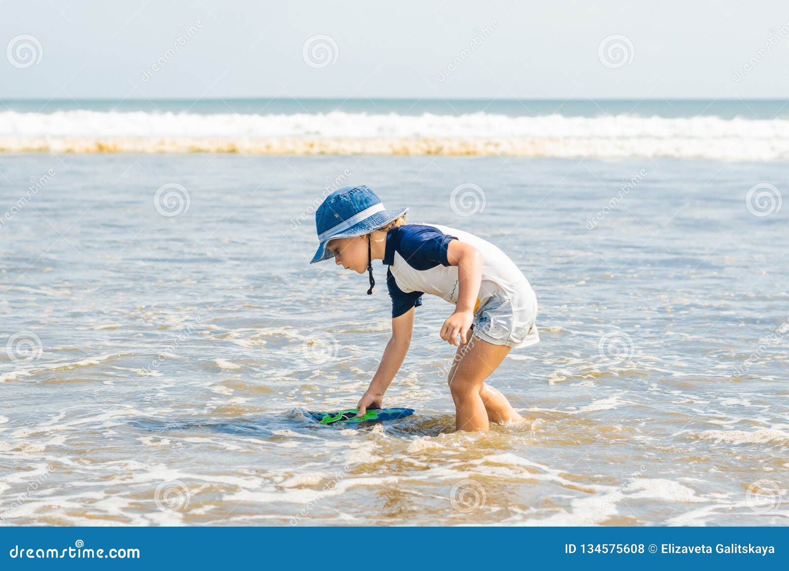 Boy Playing on the Beach in the Water Stock Photo - Image of coastline ...