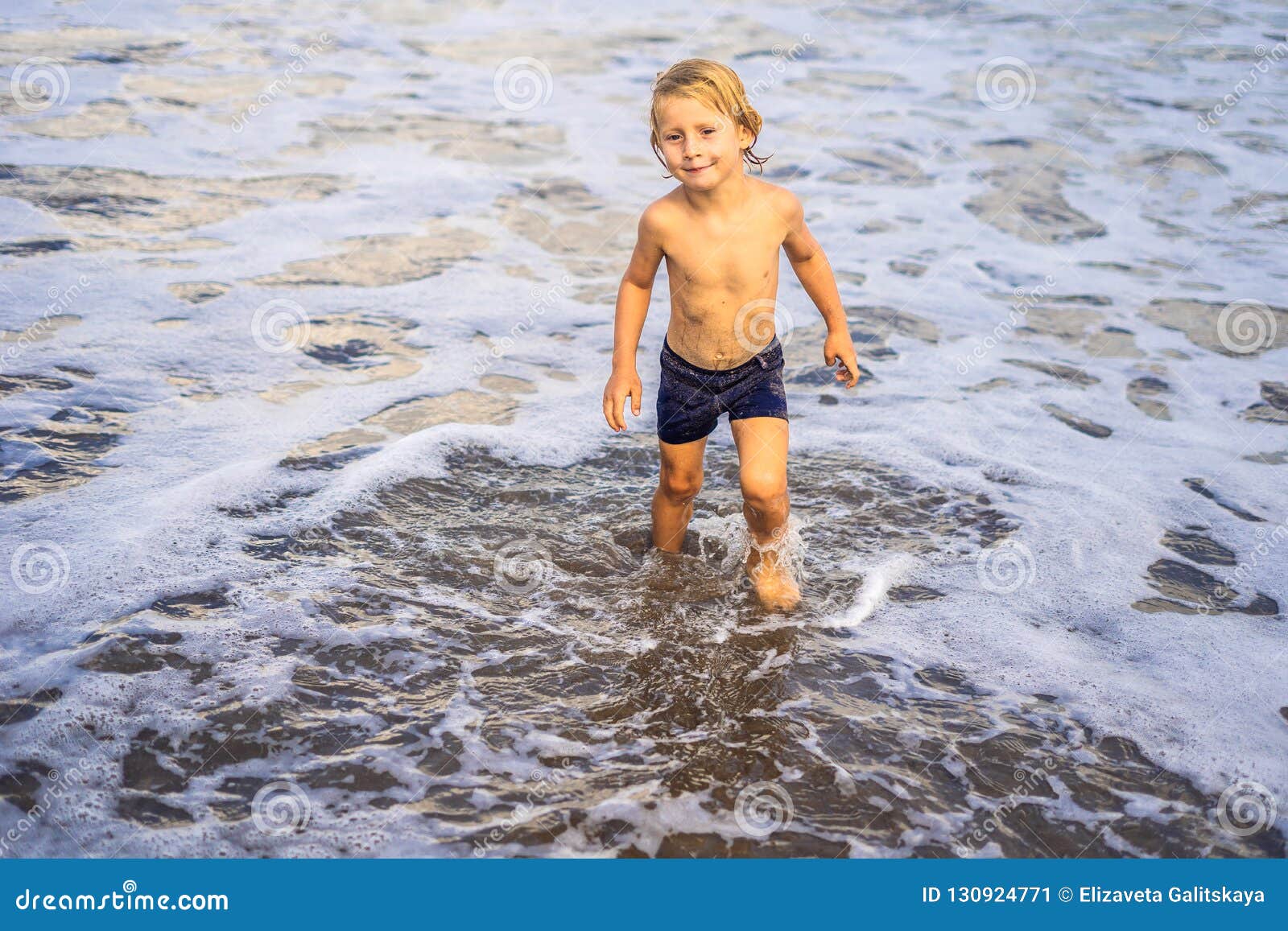 Boy Playing on the Beach in the Water Stock Image - Image of adorable ...