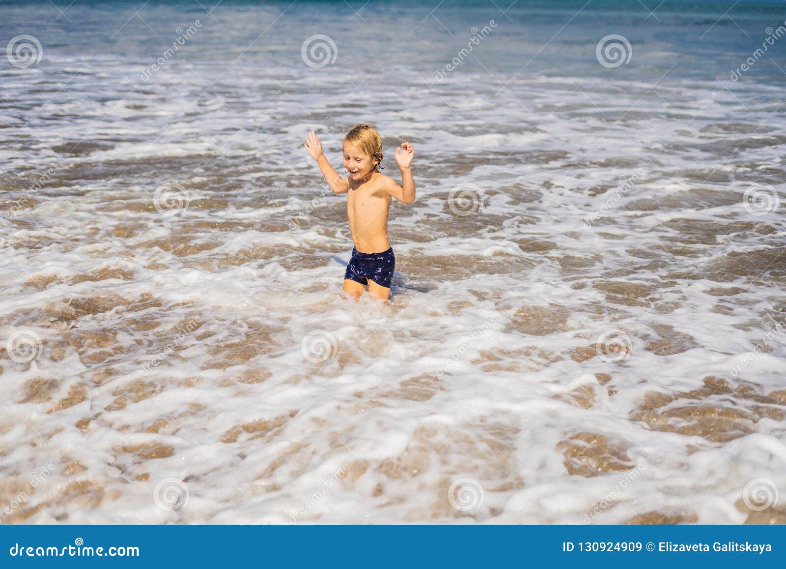Boy Playing on the Beach in the Water Stock Image - Image of child ...