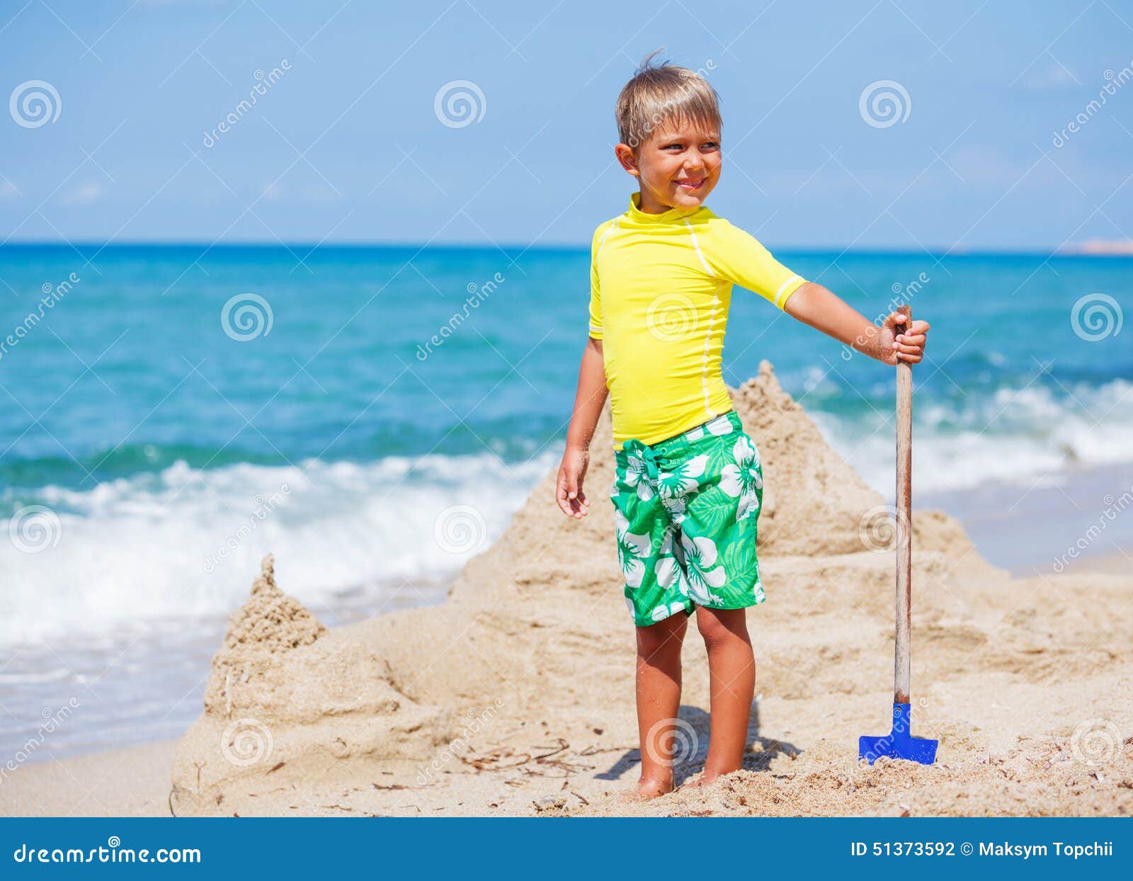 Boy playing on the beach stock photo. Image of people - 51373592