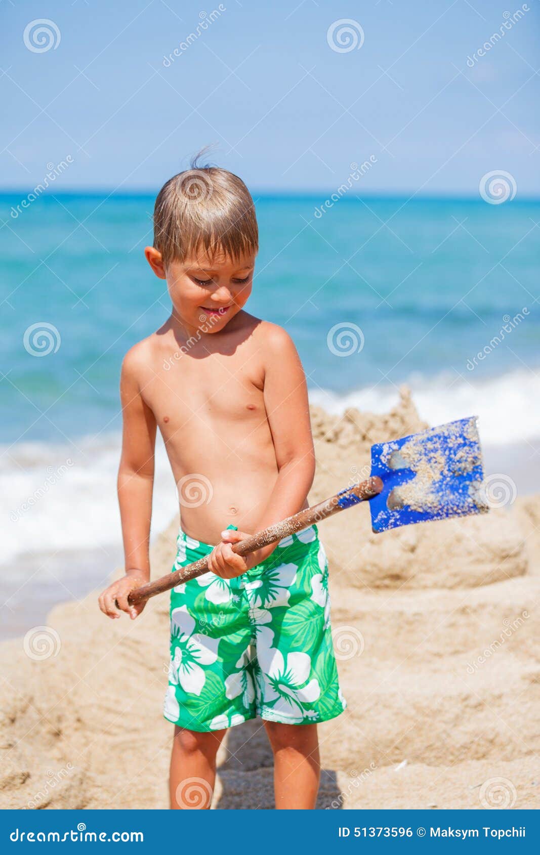 Boy playing on the beach stock photo. Image of enjoy - 51373596