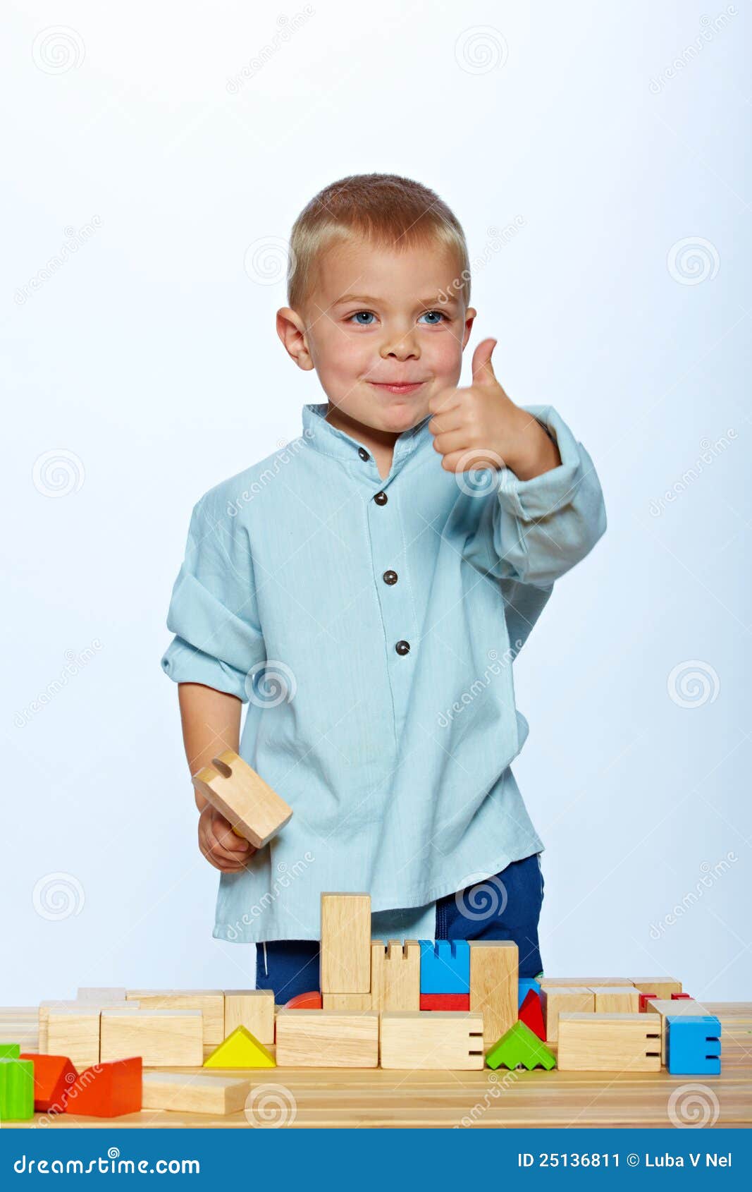 Boy playing with blocks stock image. Image of person - 25136811