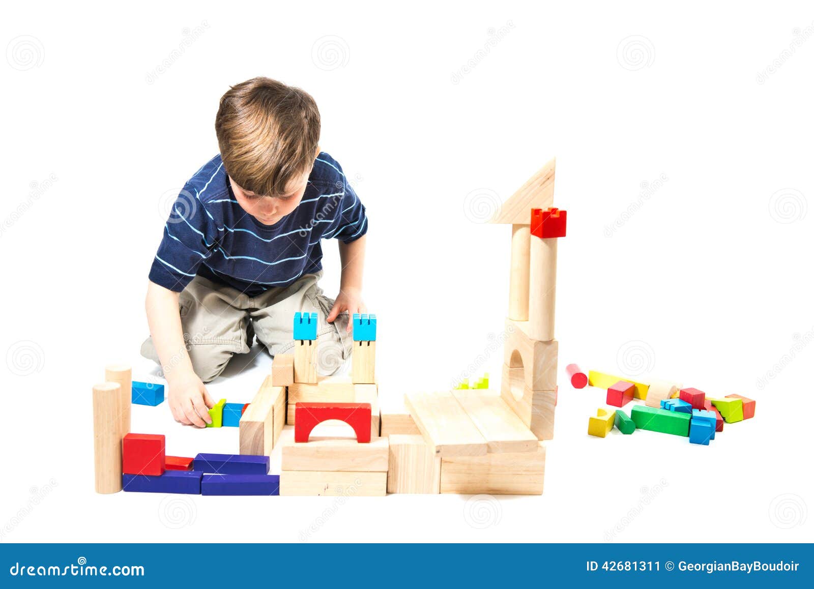 Boy playing with blocks stock image. Image of colours - 42681311