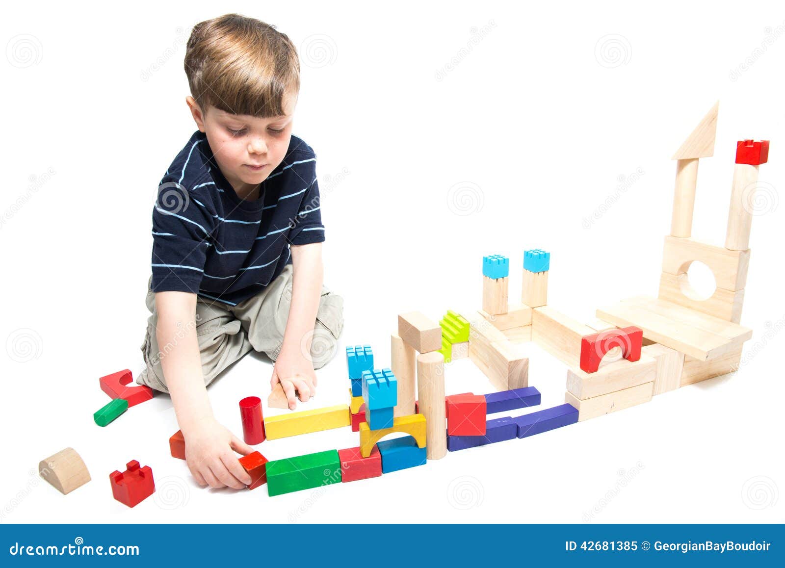 Boy playing with blocks stock image. Image of architecture - 42681385