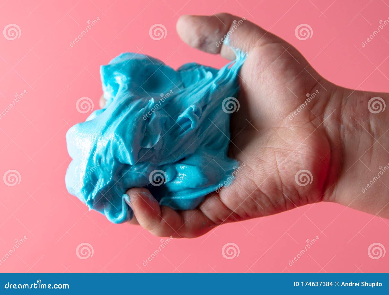 The Boy is Playing with a Blue Slime in His Hands Stock Photo - Image ...