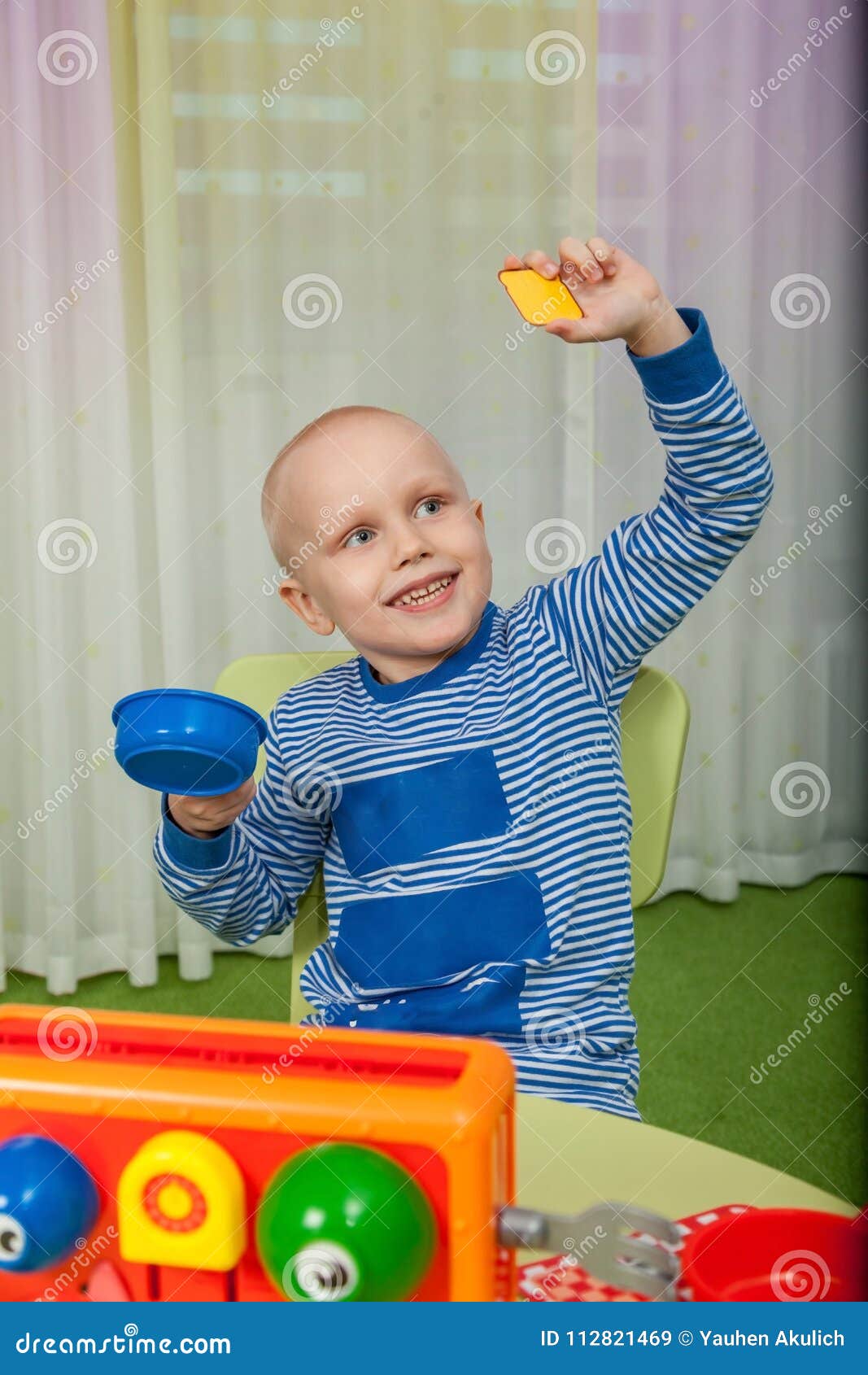 Boy playing a board game stock image. Image of background - 112821469