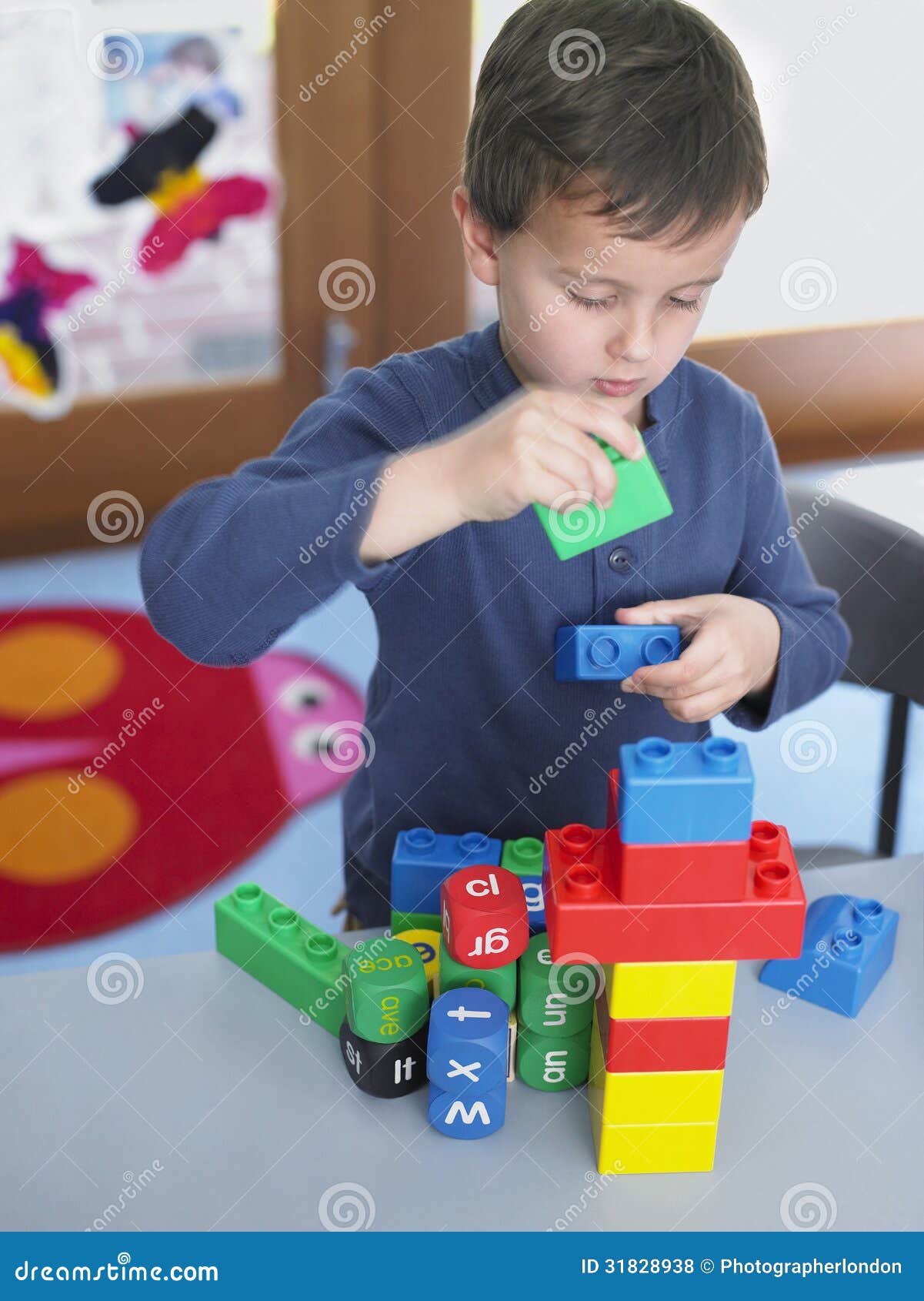 Boy Playing with Building Blocks in Class Stock Photo - Image of ...