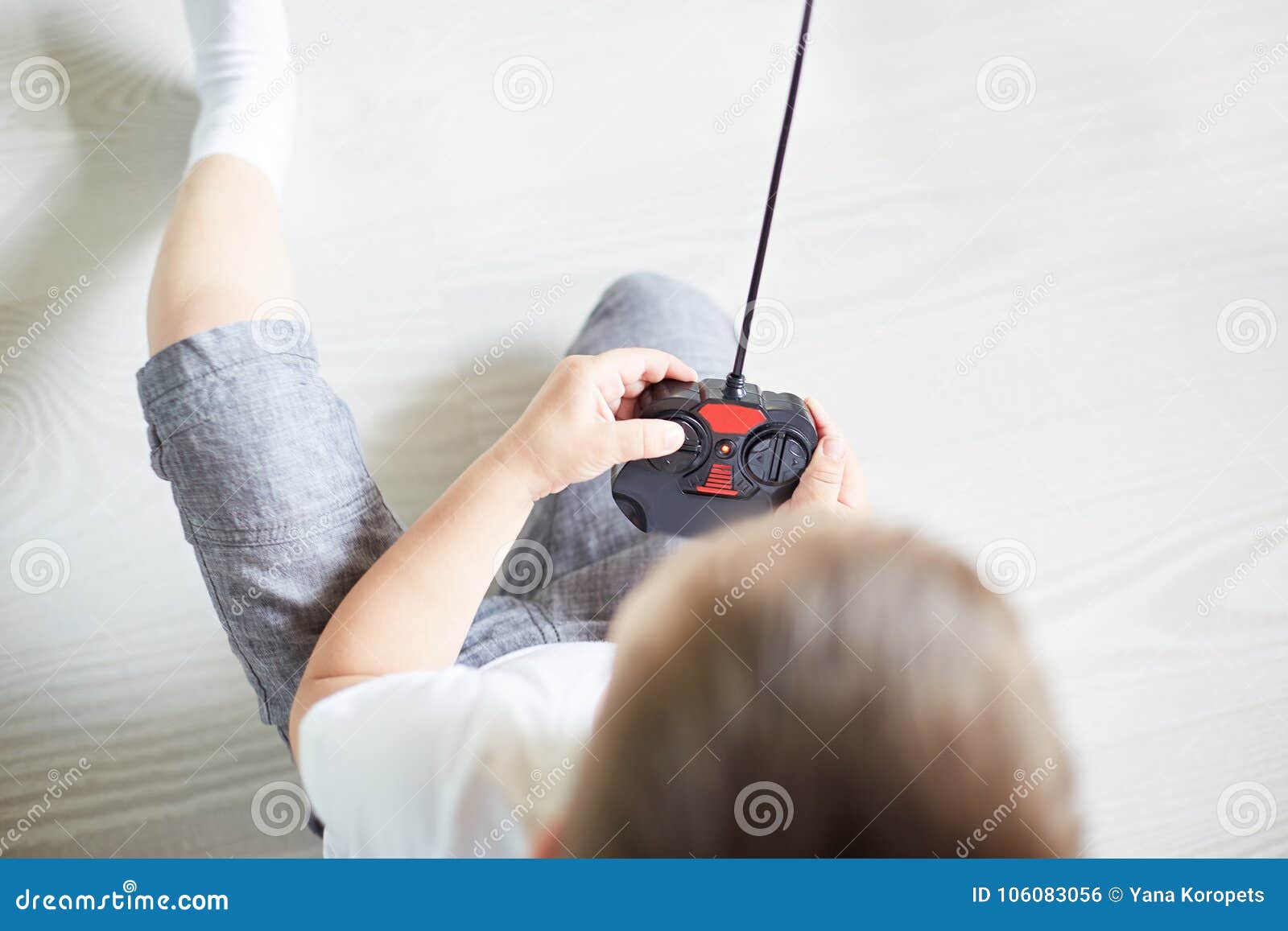 A Boy Playing with a Car Remote Stock Photo - Image of person, graphic ...