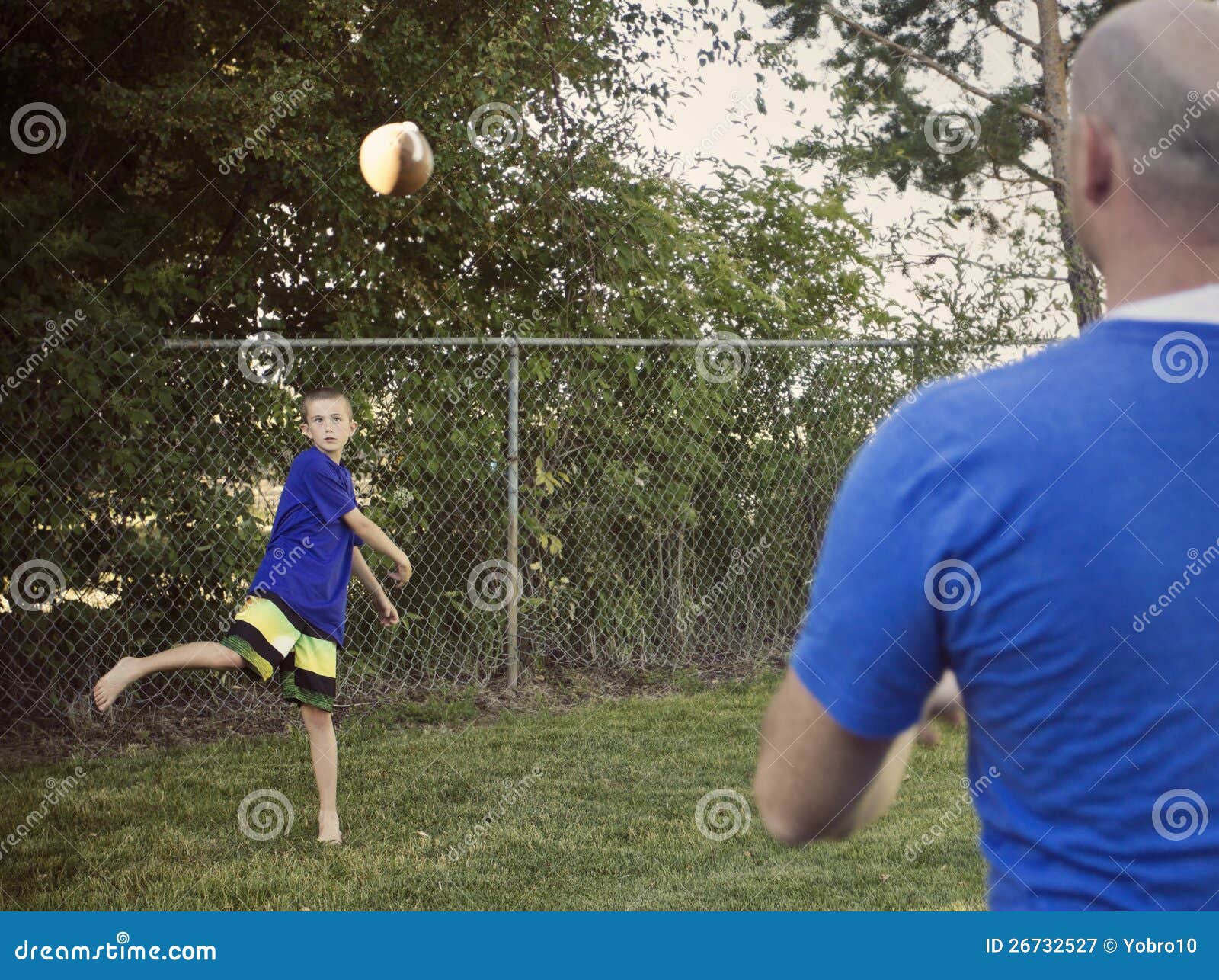 Boy Playing Catch with Dad stock image. Image of playing - 26732527
