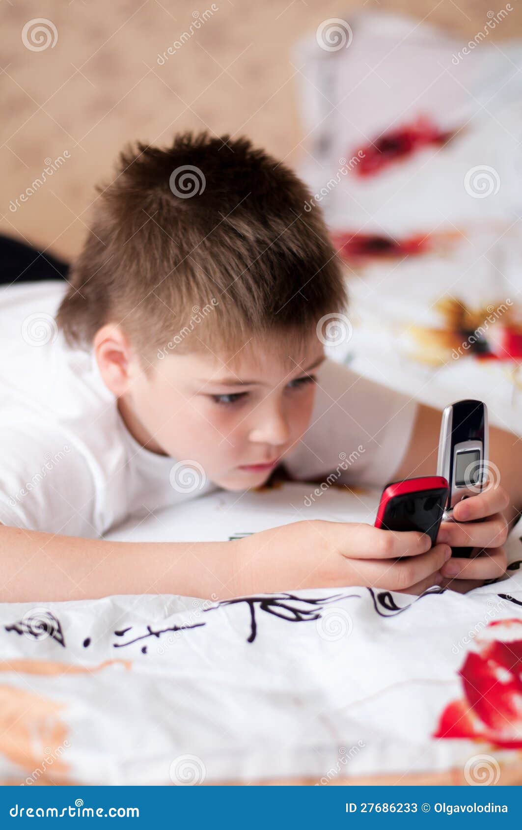 Boy playing on cell phones stock image. Image of people - 27686233