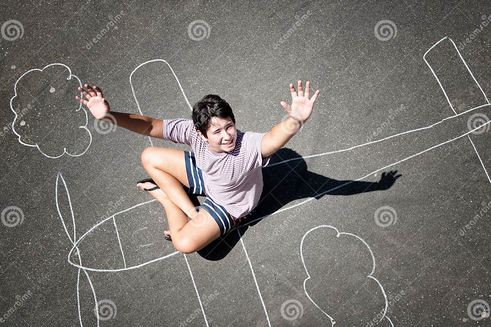 Boy Playing in a Chalk Airplane Stock Photo - Image of child, handsome ...