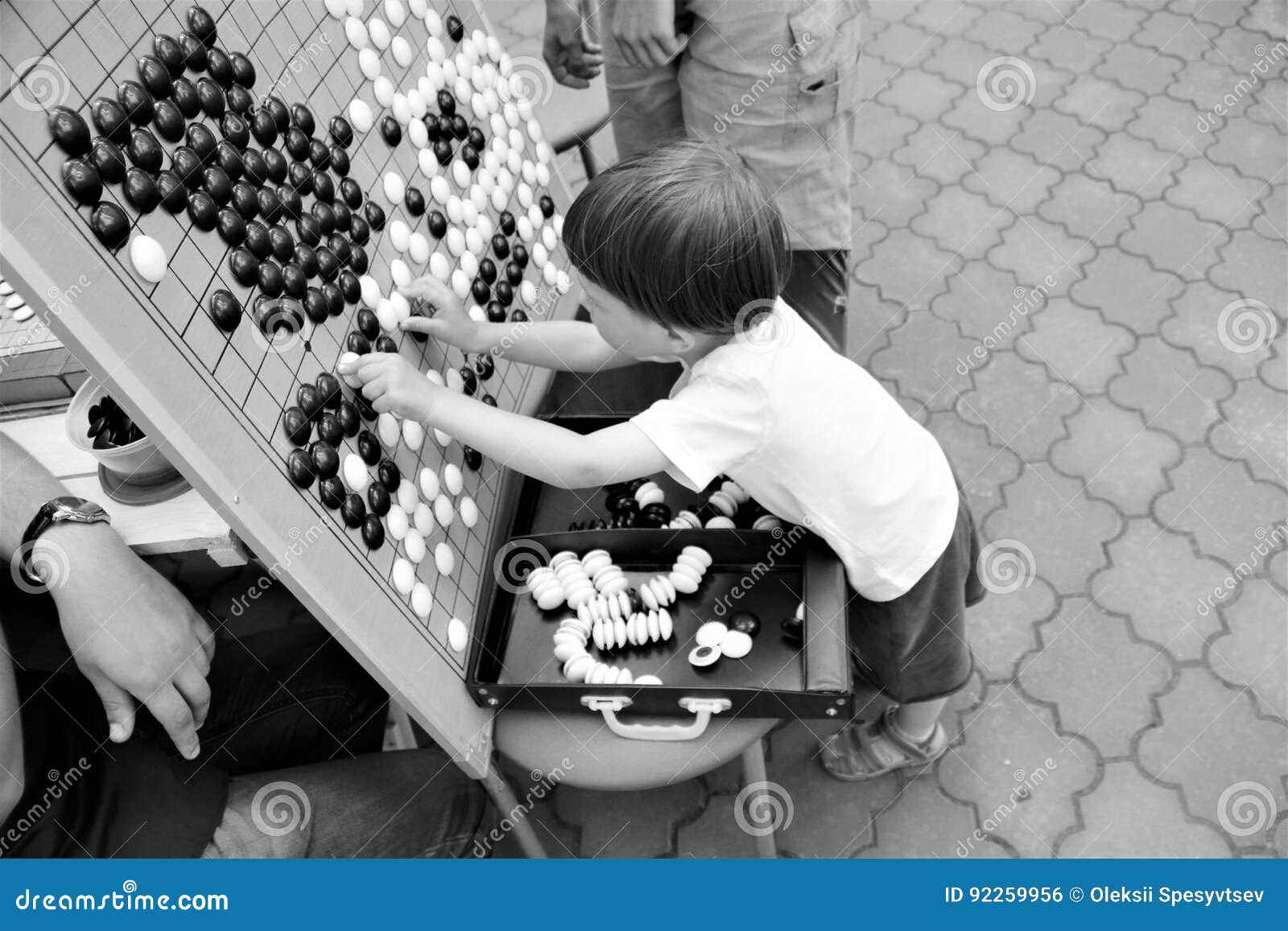 Boy Playing Chinese Game Go Stock Photo - Image of kids, culture: 92259956