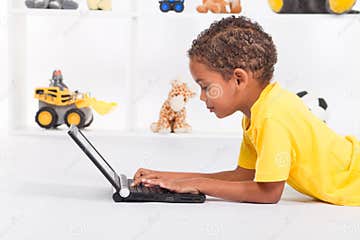 Boy playing computer stock image. Image of happy, laptop - 15528221
